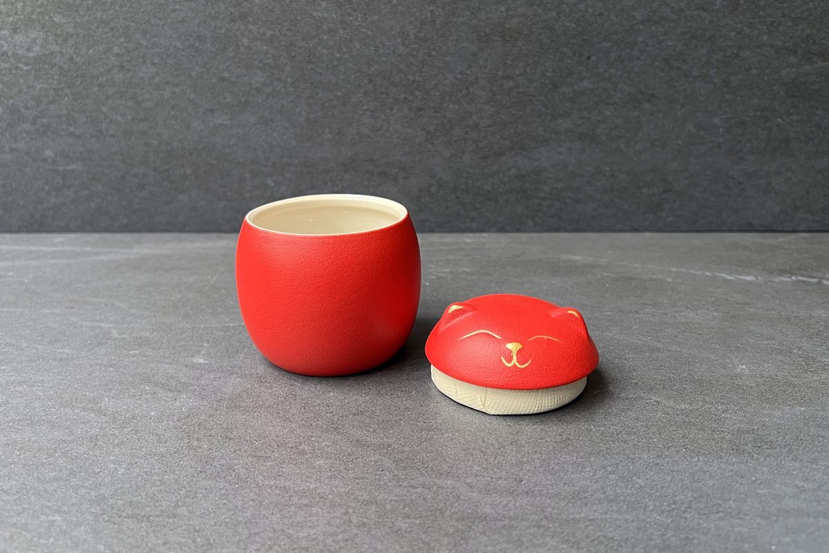 red ceramic tea caddy